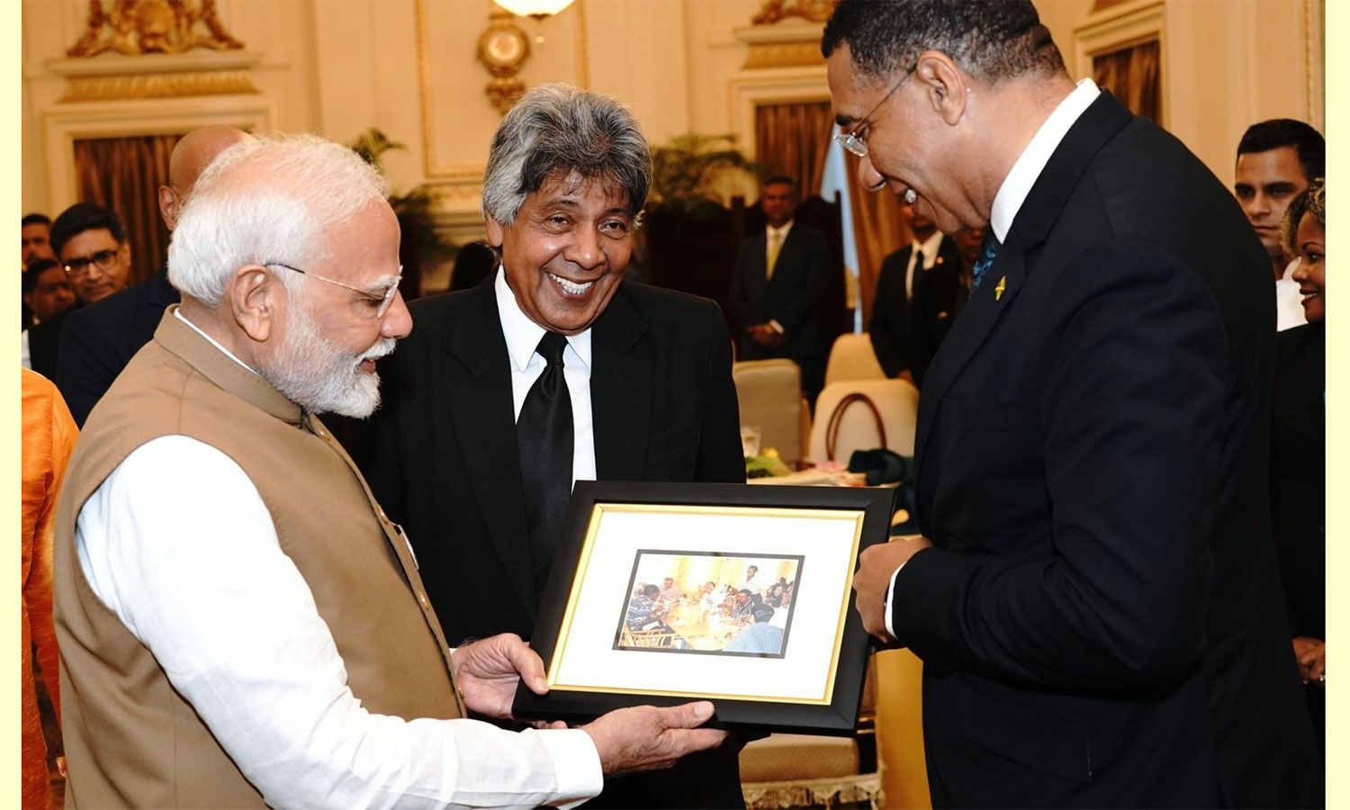 Jamaica PM Dr Andrew Holness presented a photo of PM Modis visit to ...